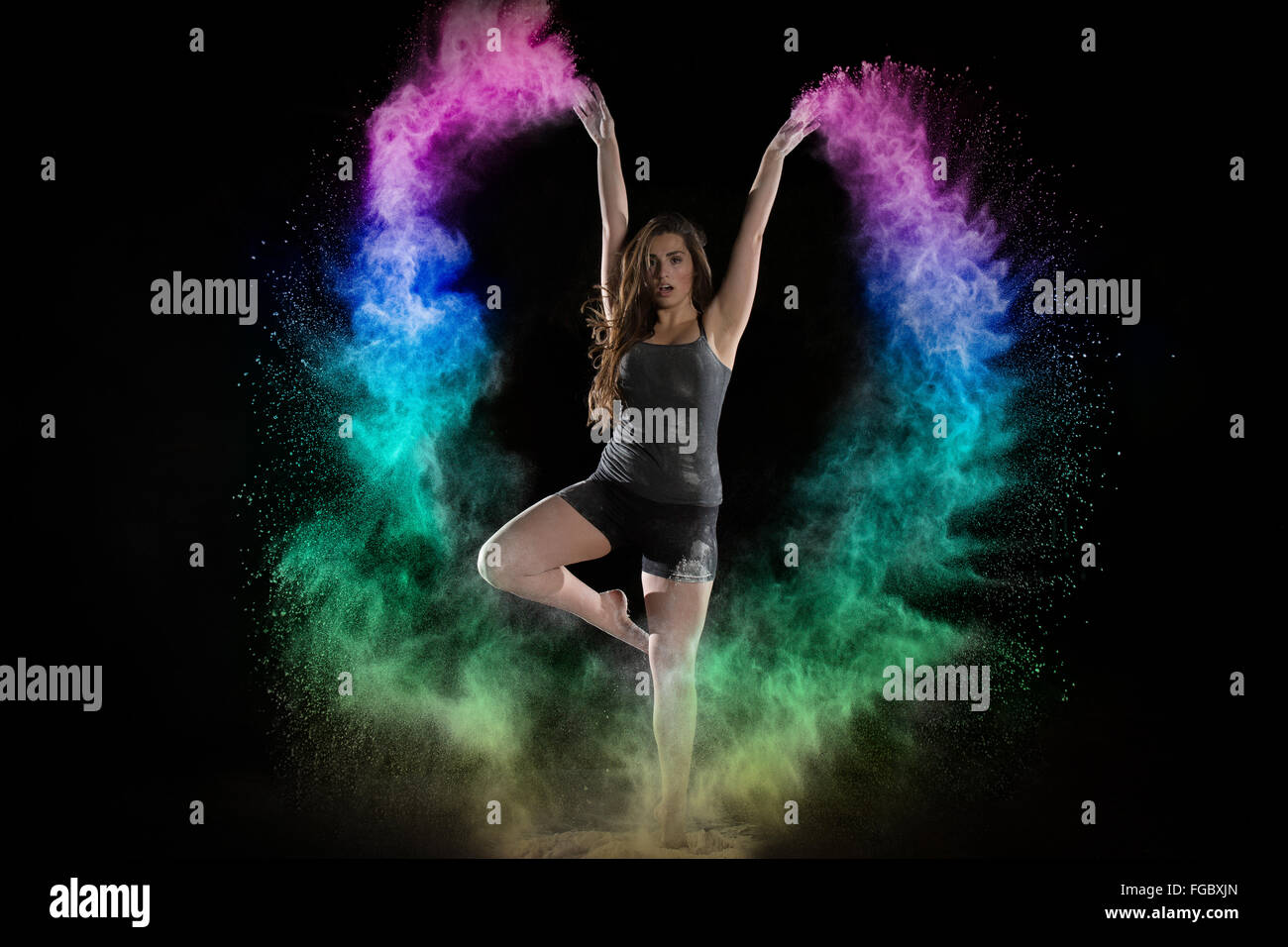 ballet dancer throwing colorful flour in a wing pattern Stock Photo - Alamy