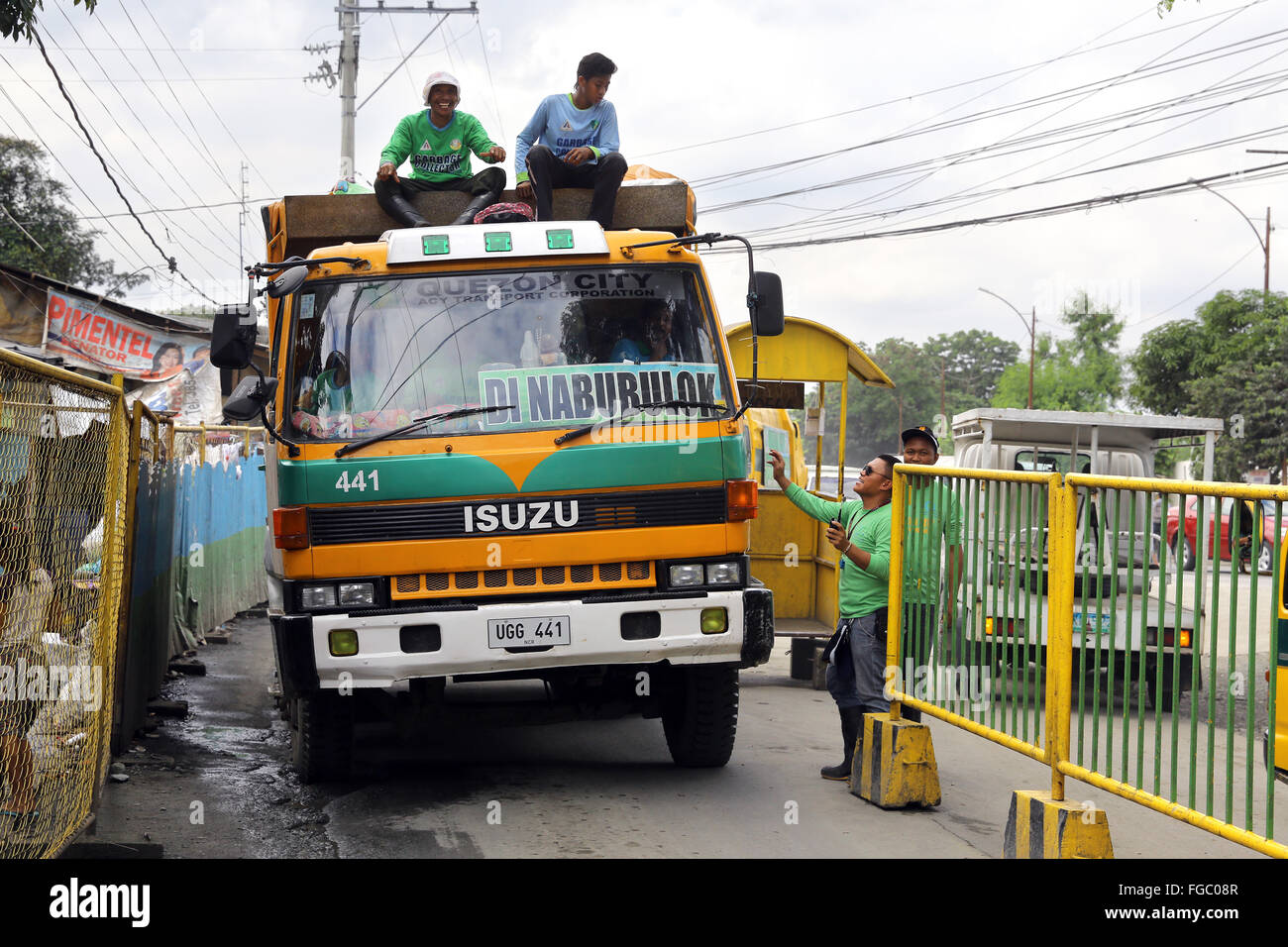 Garbage trucks at the entrance to Payatas garbage landfill, dump site ...