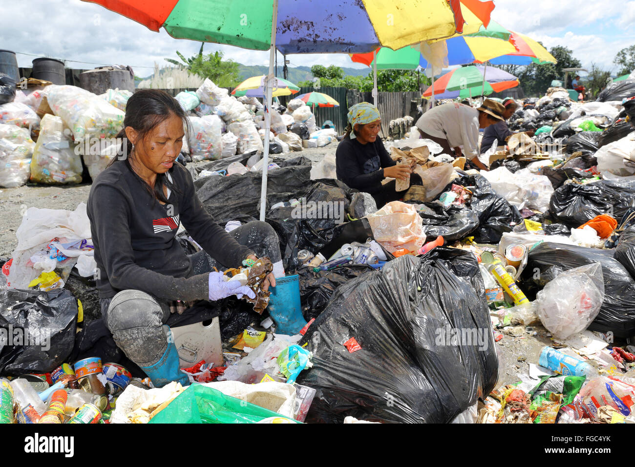 Women work in a waste separation and resale in a Junk Shop near the ...