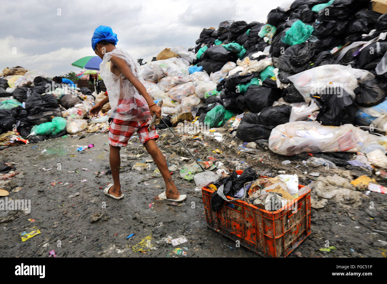 Boy (14) works in a waste separation and resale in a Junk Shop near the ...