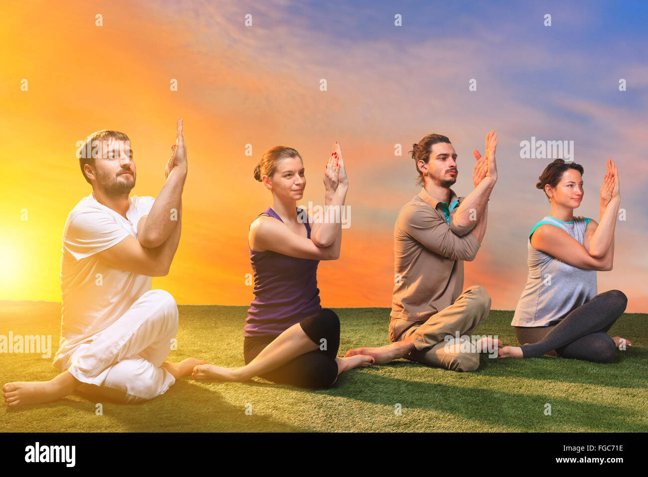 Group young people doing yoga hi-res stock photography and images - Alamy