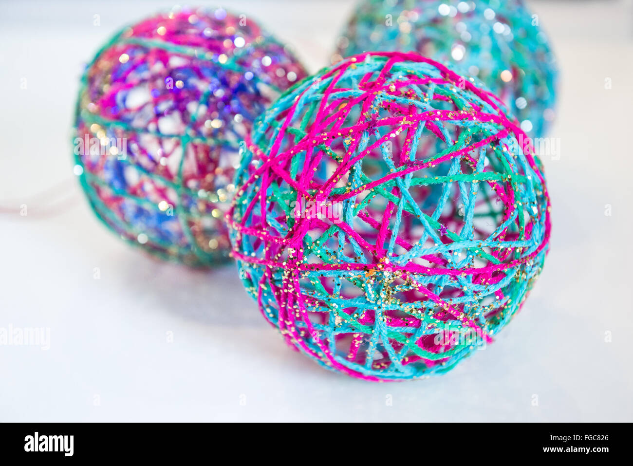 homemade DIY christmas balls made of yarn strings and glue Stock Photo ...