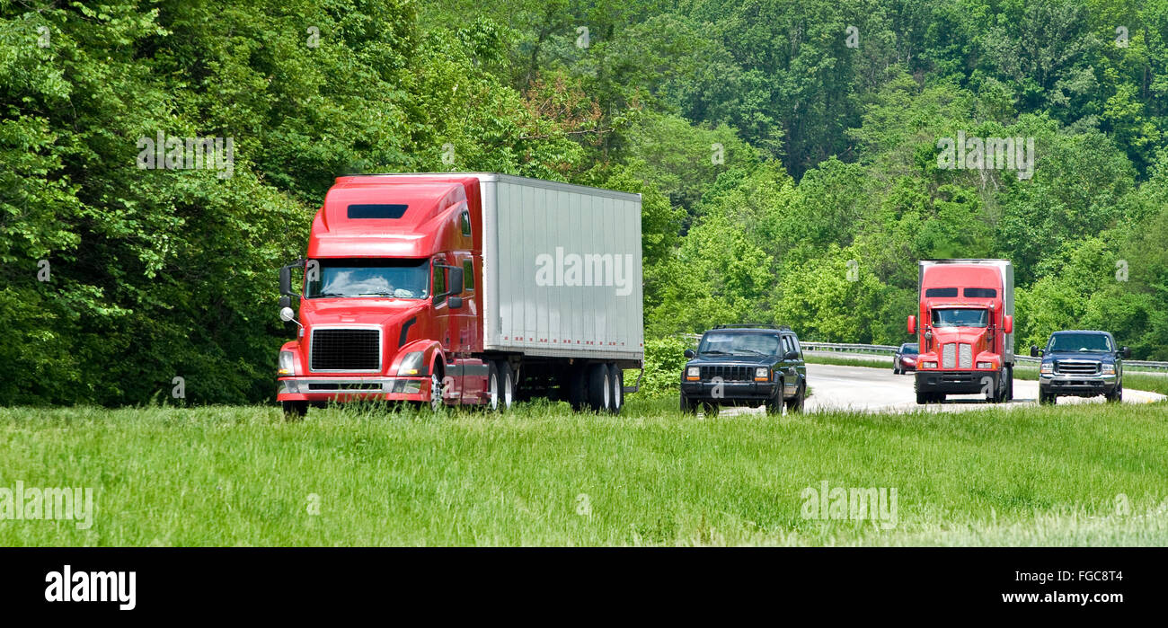 Two Red Semis In Interstate Traffic Stock Photo - Alamy
