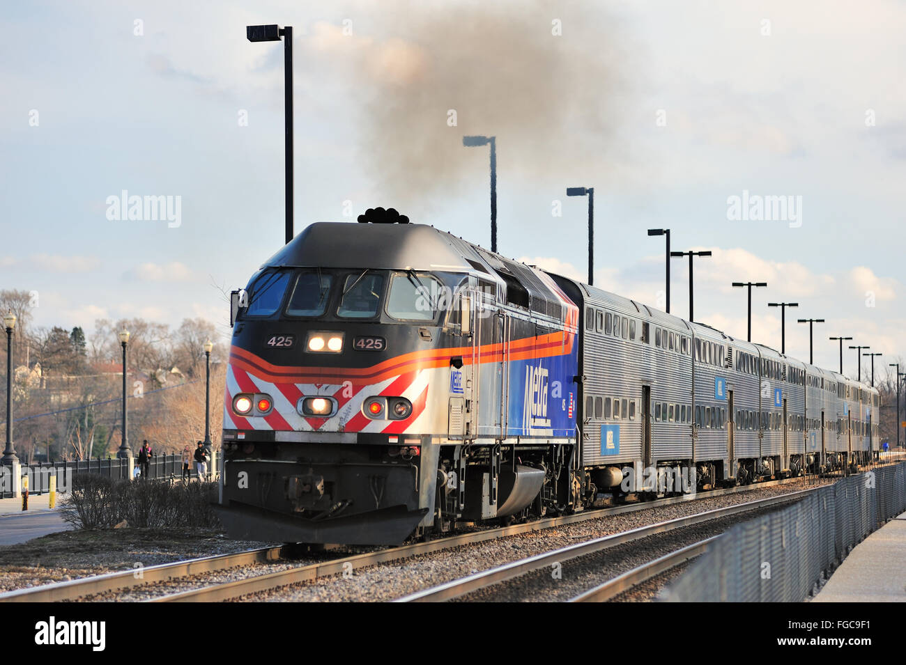 A Metra commuter train departing from the National Street Station in ...