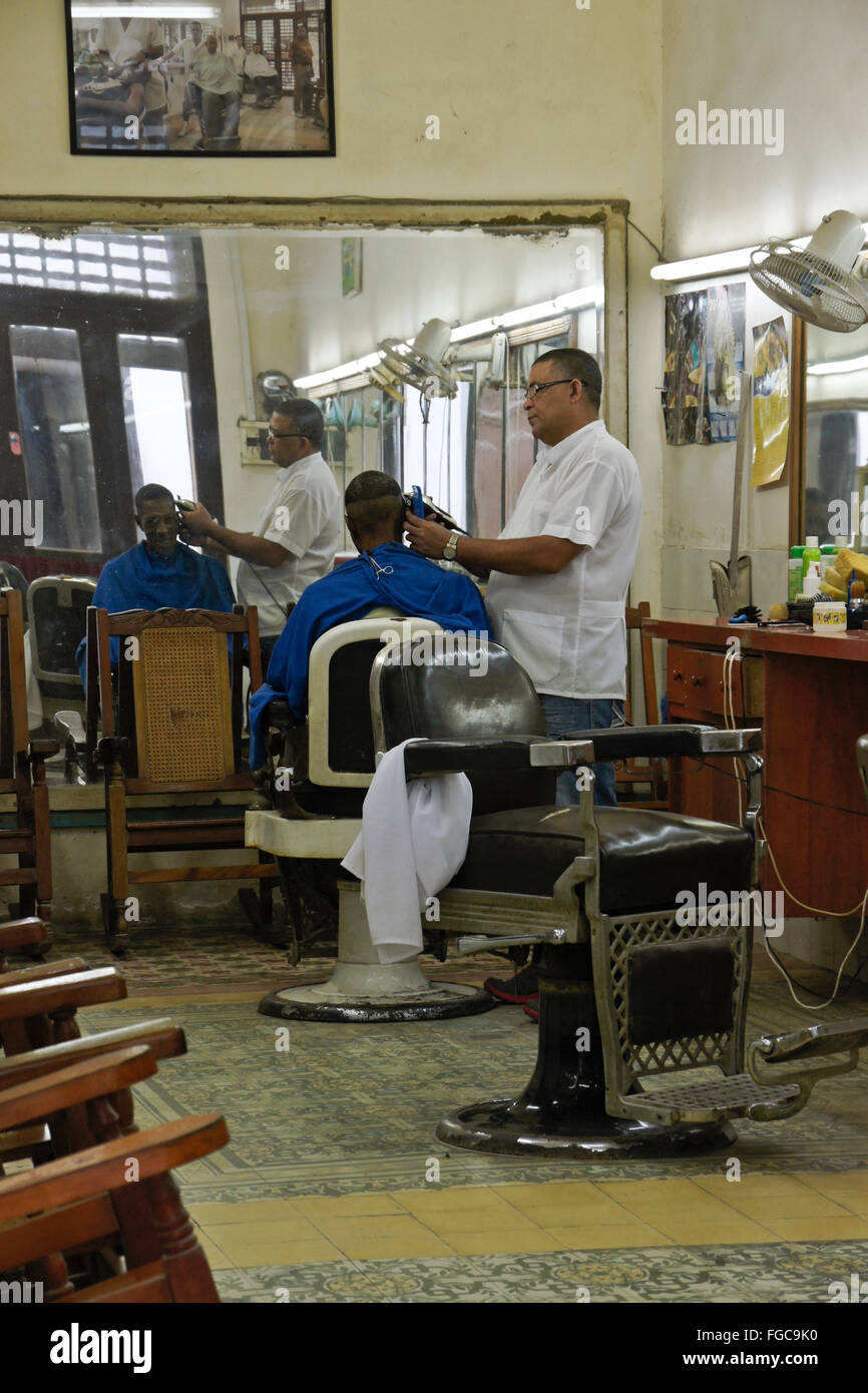 Barber and customer in barber shop, Habana Vieja (Old Havana), Cuba ...