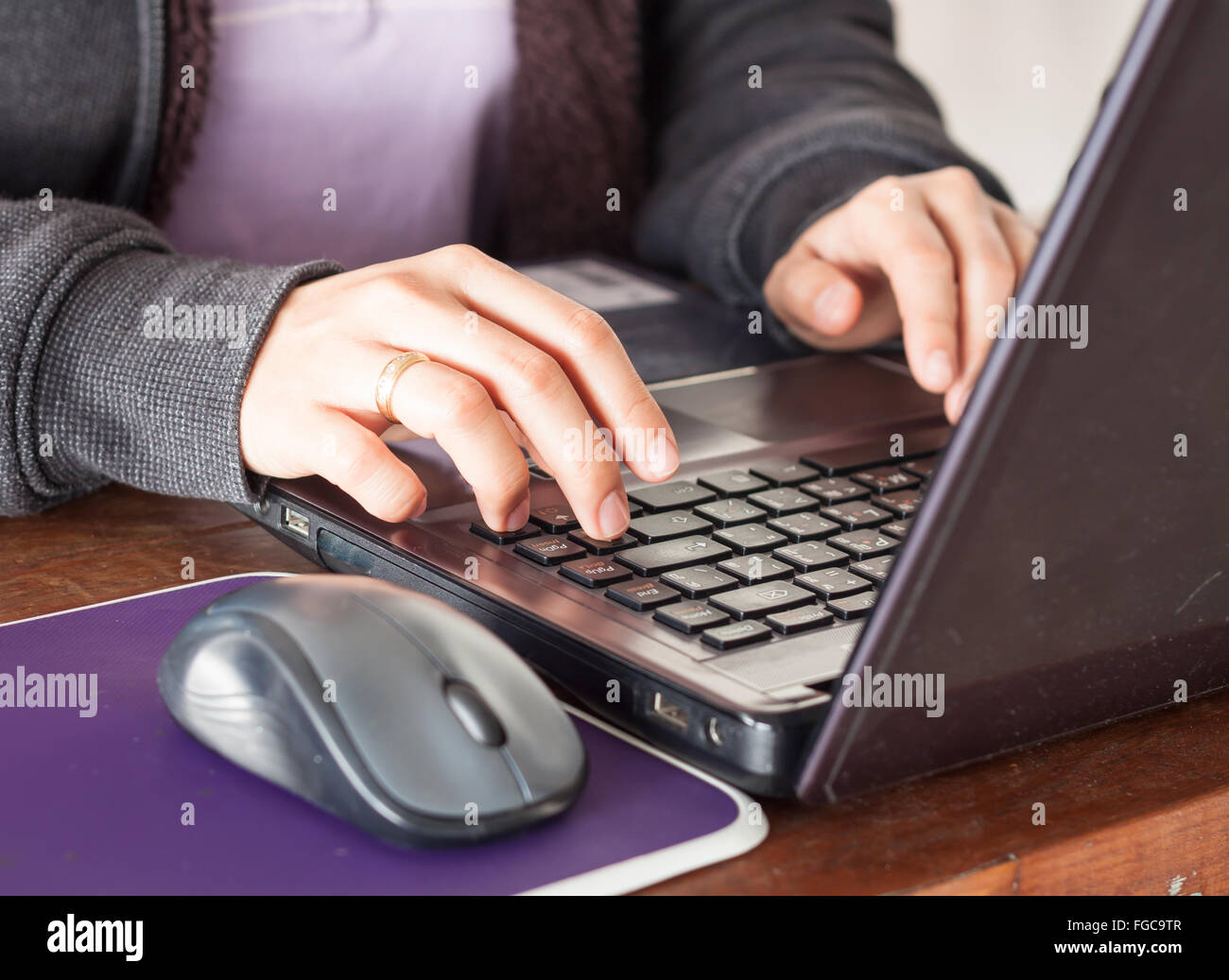 Woman using laptop at office desk, stock photo Stock Photo - Alamy