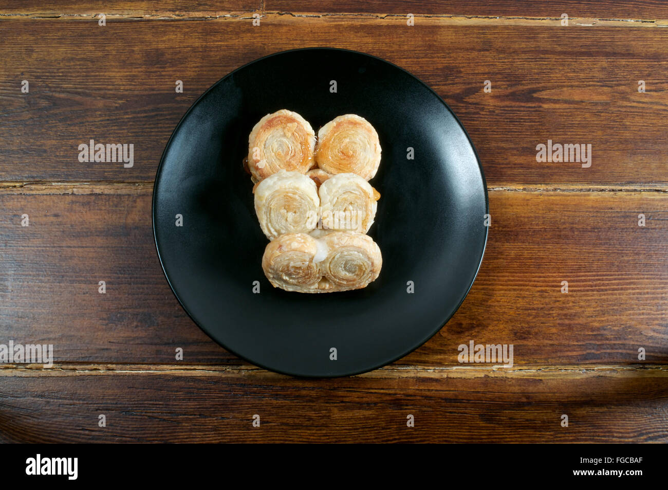 Puff pastry from top on the place plate over wooden table Stock Photo ...