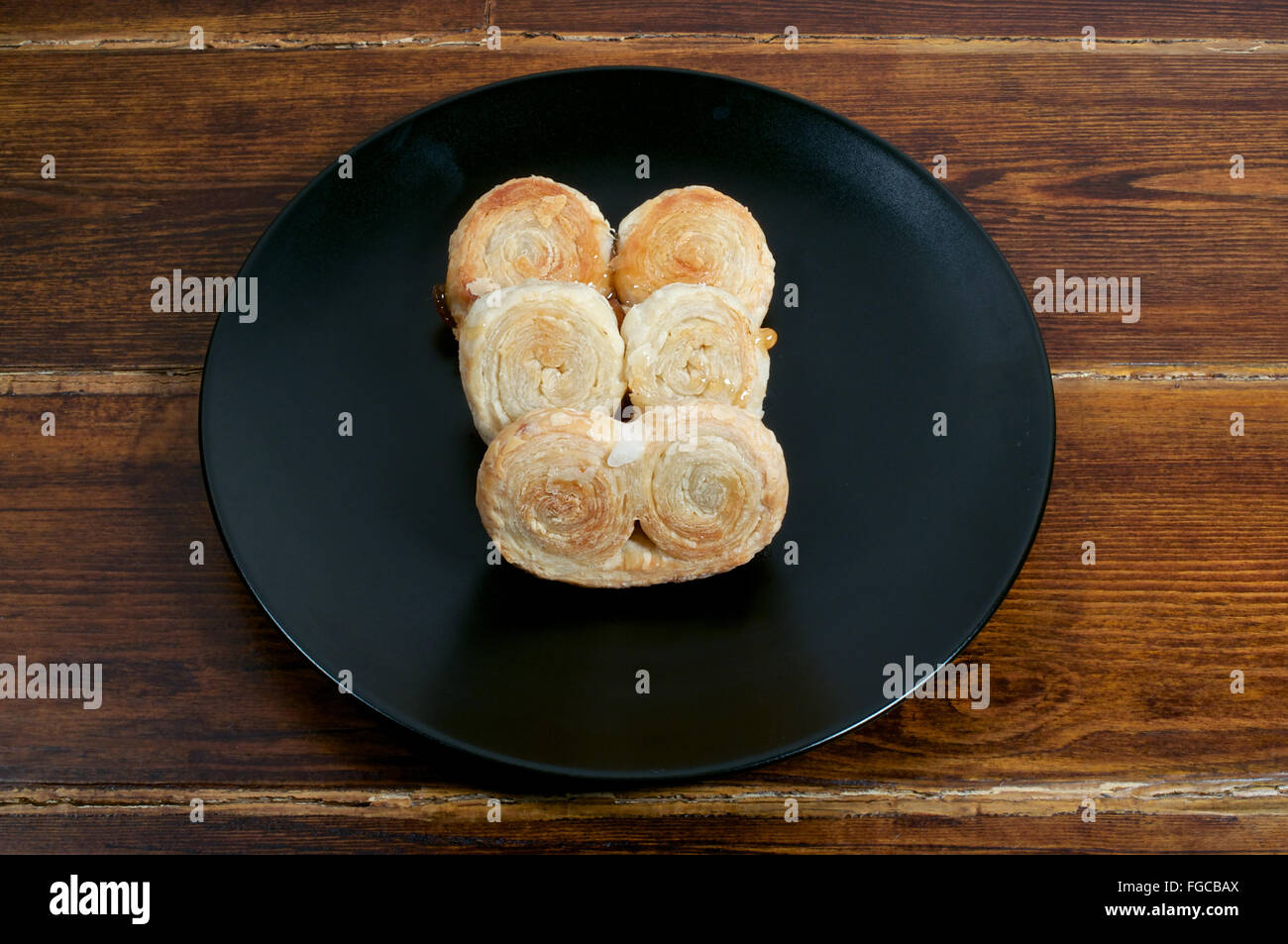 Puff pastry from top on the place plate over wooden table Stock Photo ...