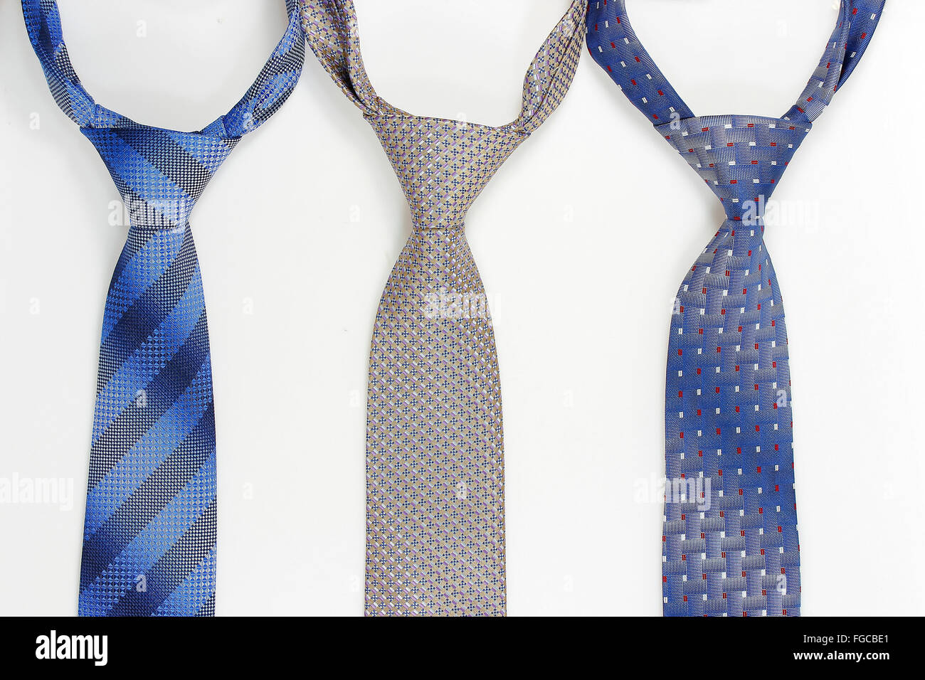 More colorful neckties on a white background Stock Photo - Alamy