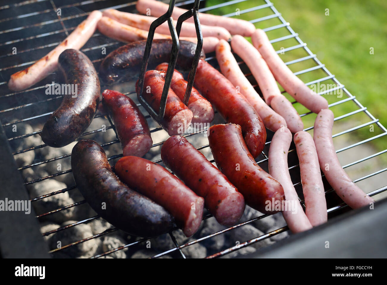 Sausage, blood sausage roasted on the grill garden barbecue . Grilled ...