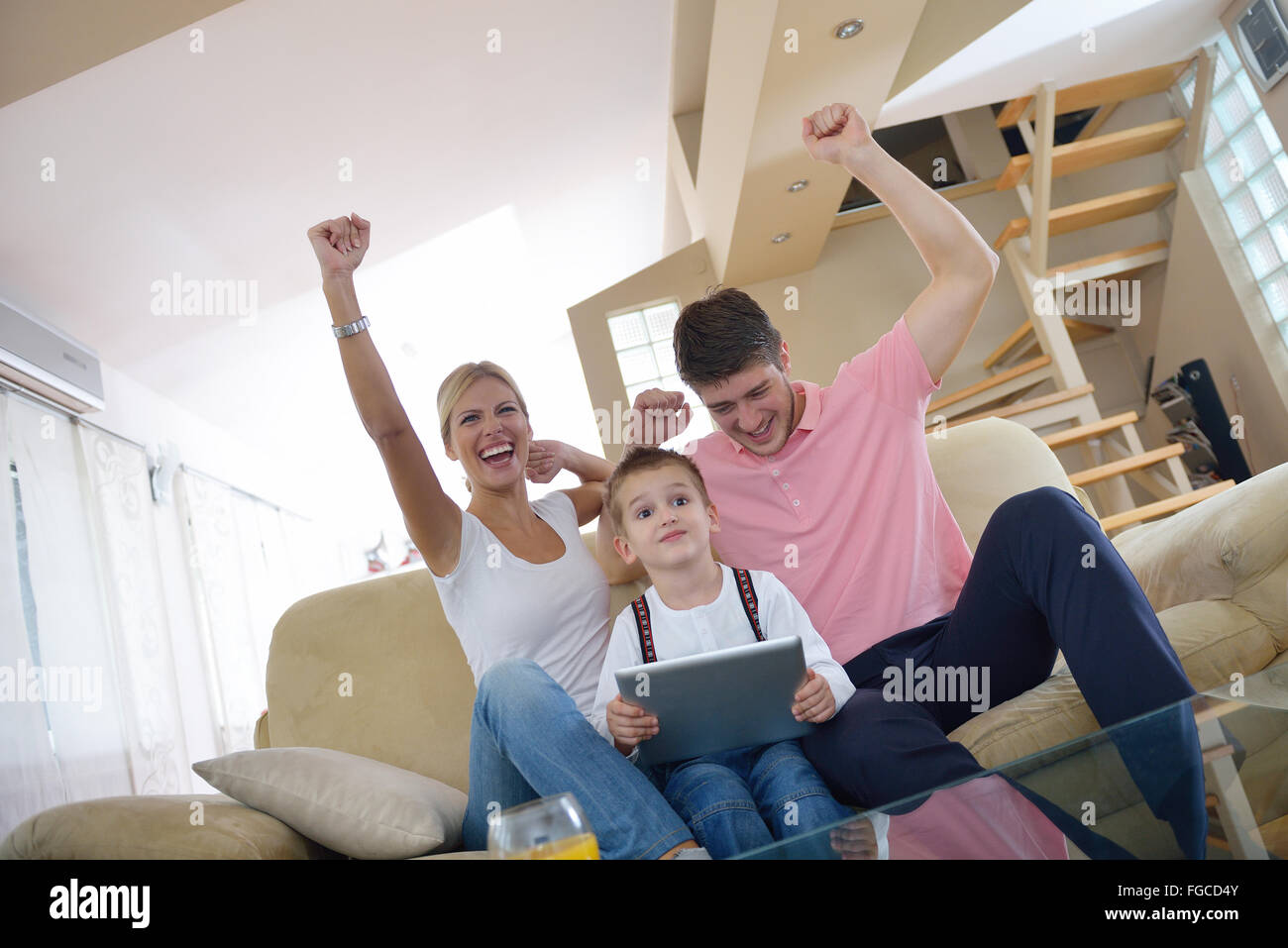 family at home using tablet computer Stock Photo - Alamy