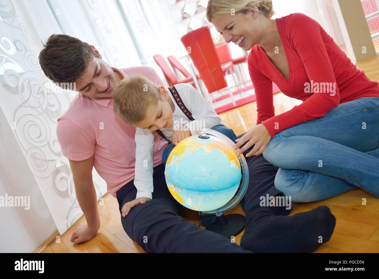 family have fun with globe Stock Photo - Alamy
