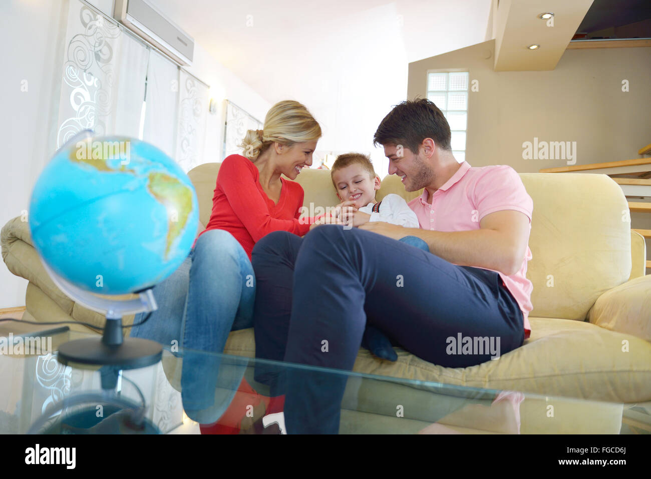 family have fun with globe Stock Photo - Alamy