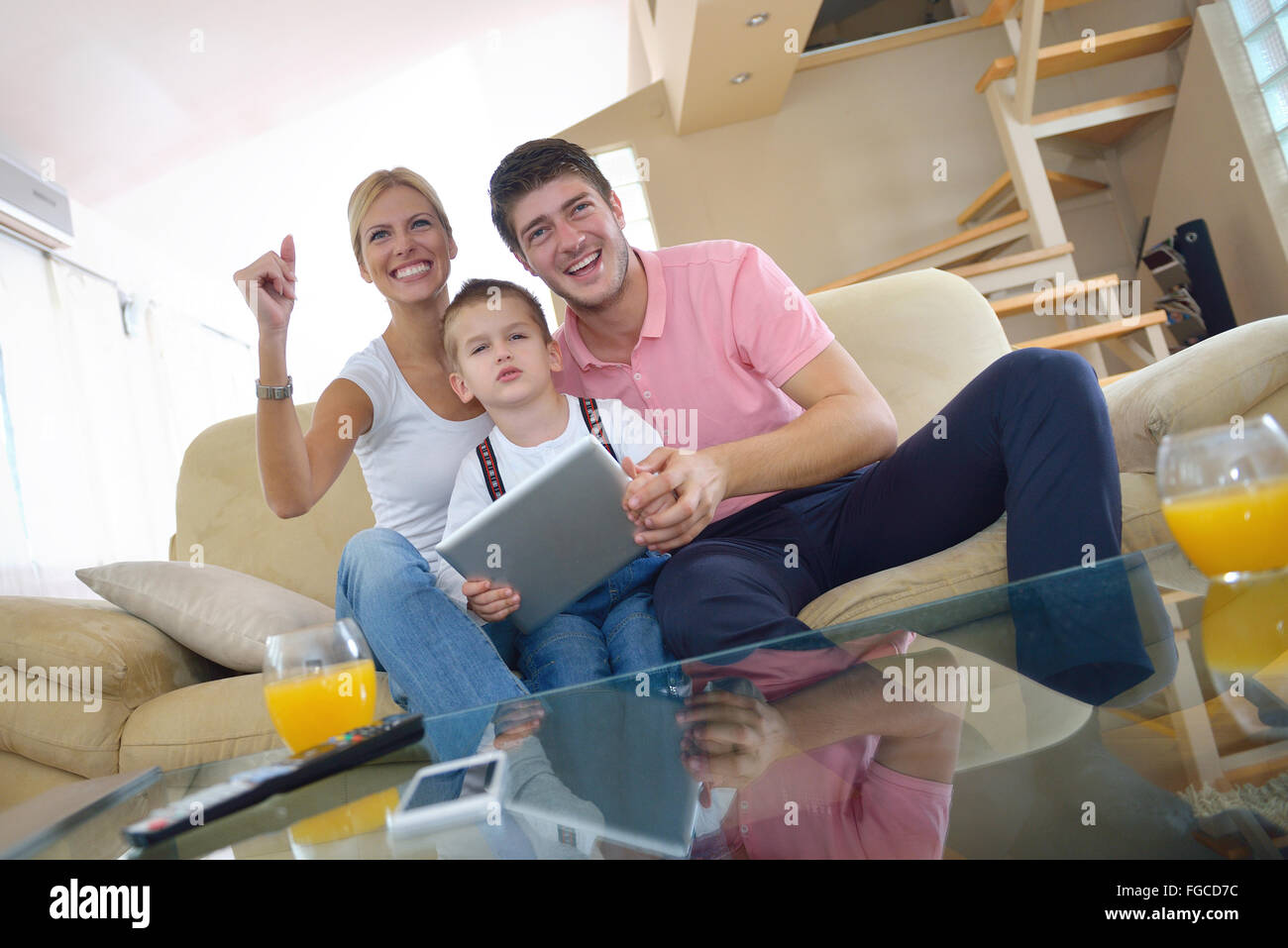 family at home using tablet computer Stock Photo - Alamy