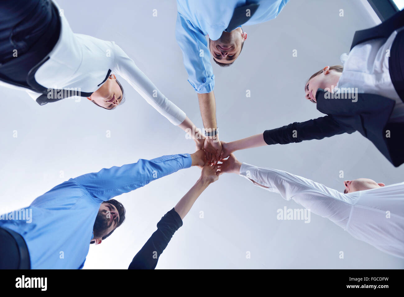 business people group joining hands Stock Photo - Alamy