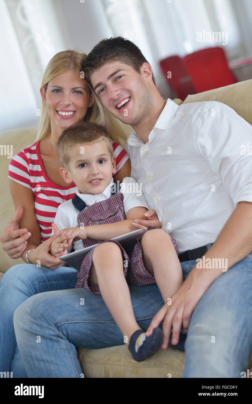 family at home using tablet computer Stock Photo - Alamy