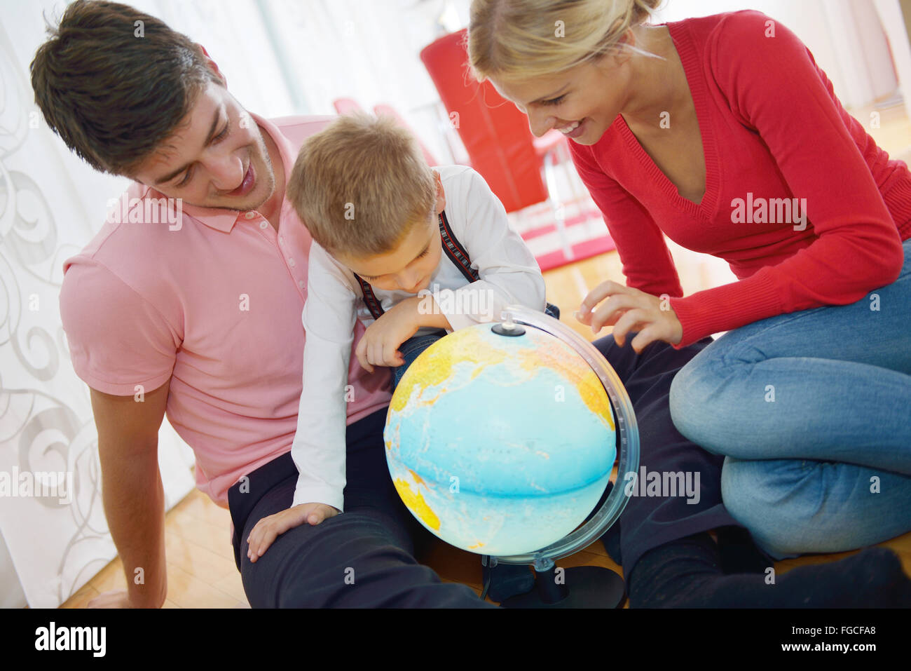 family have fun with globe Stock Photo - Alamy