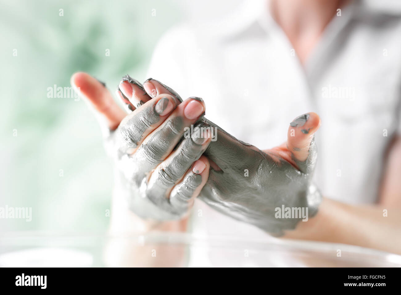 Women's hands during surgery cosmetic hands with the applied mask with ...