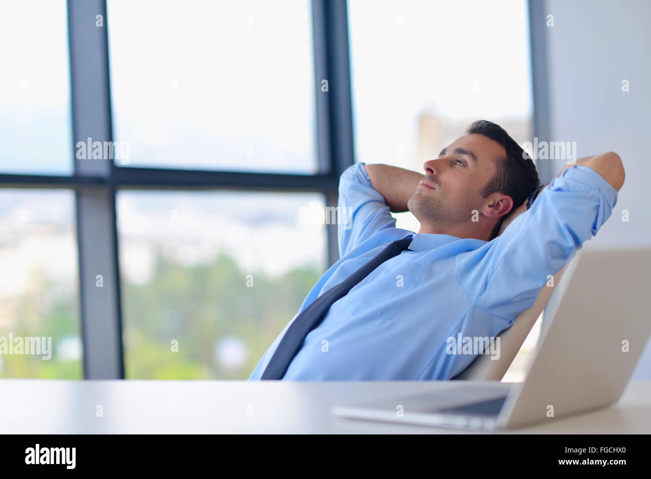 happy young business man at office Stock Photo - Alamy