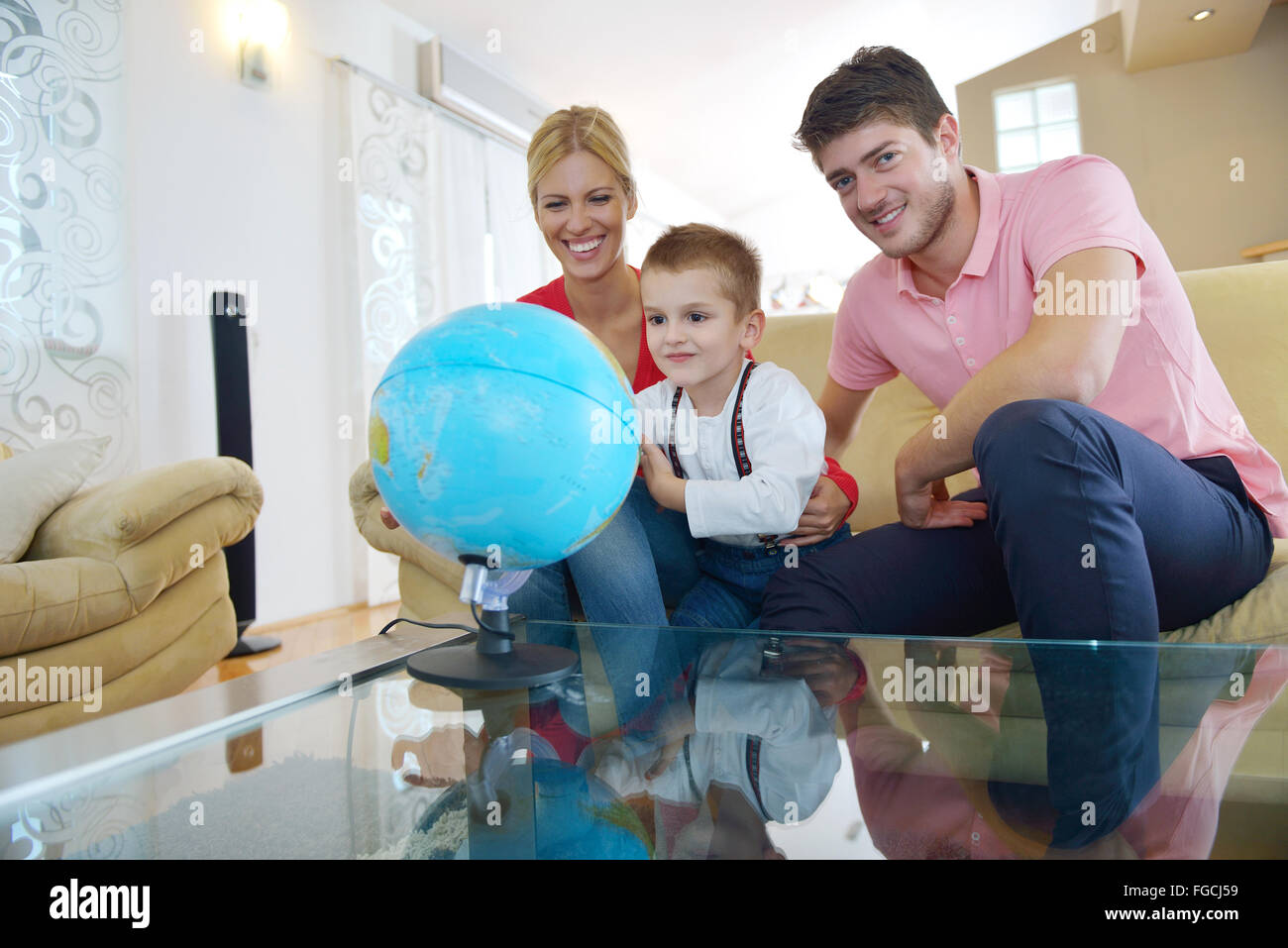 family have fun with globe Stock Photo - Alamy