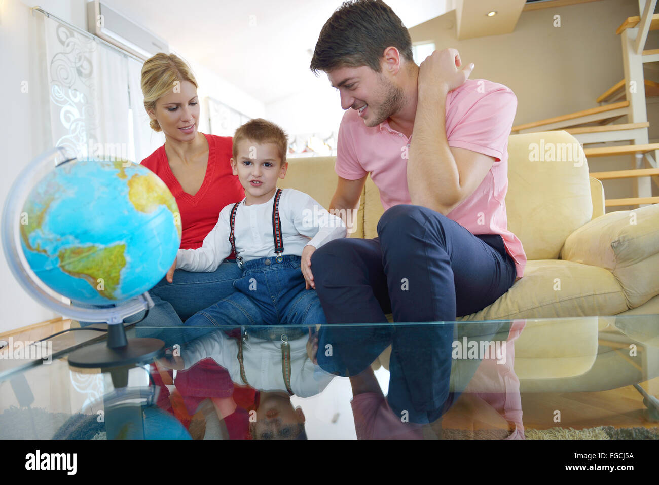 family have fun with globe Stock Photo - Alamy