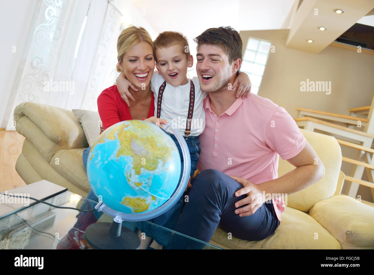 family have fun with globe Stock Photo - Alamy