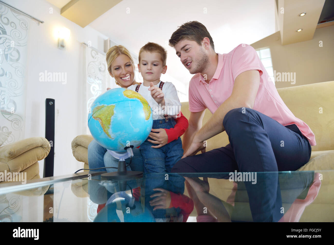 family have fun with globe Stock Photo - Alamy