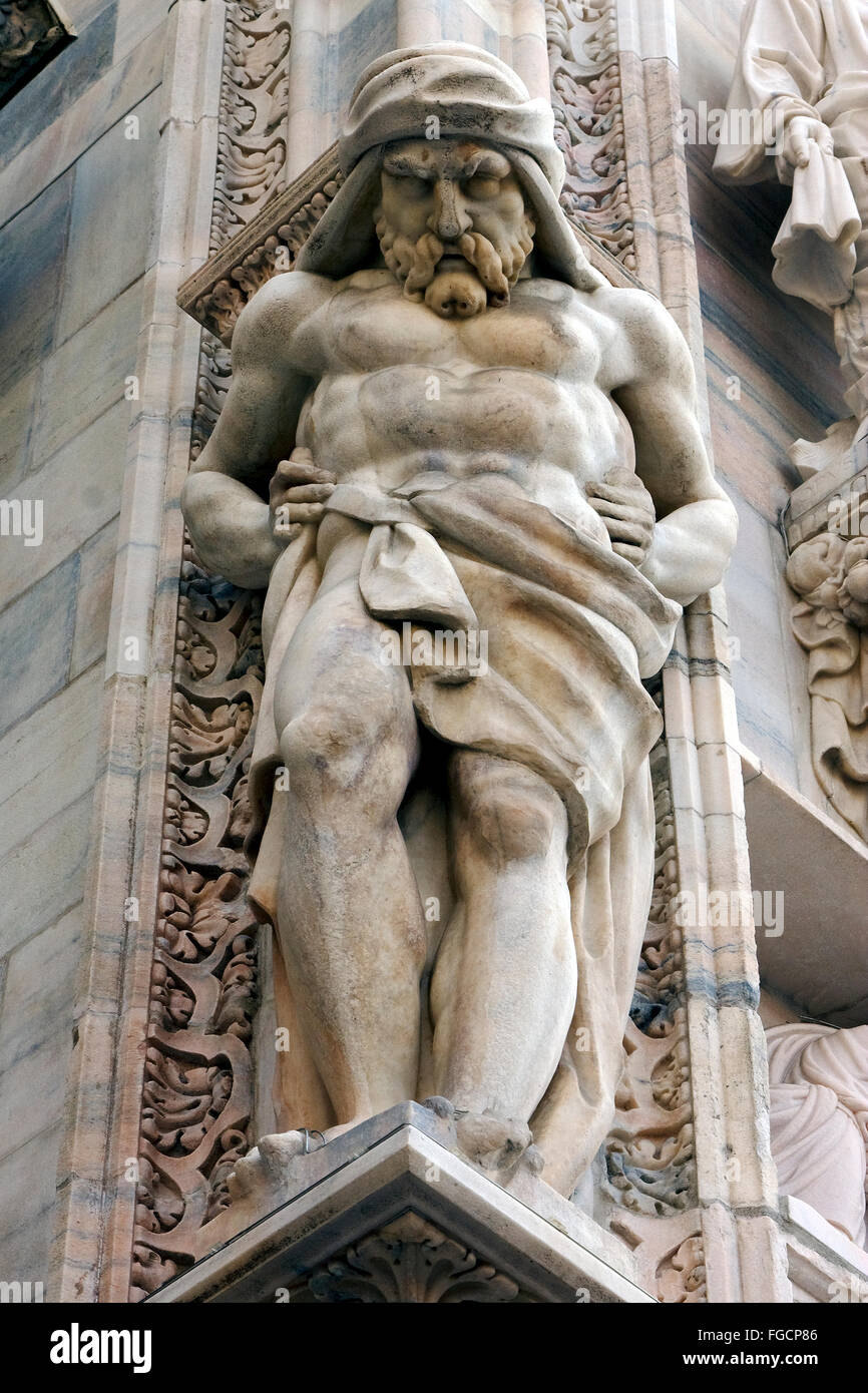 italy statue of a men in the front of the duomo church in milan Stock ...