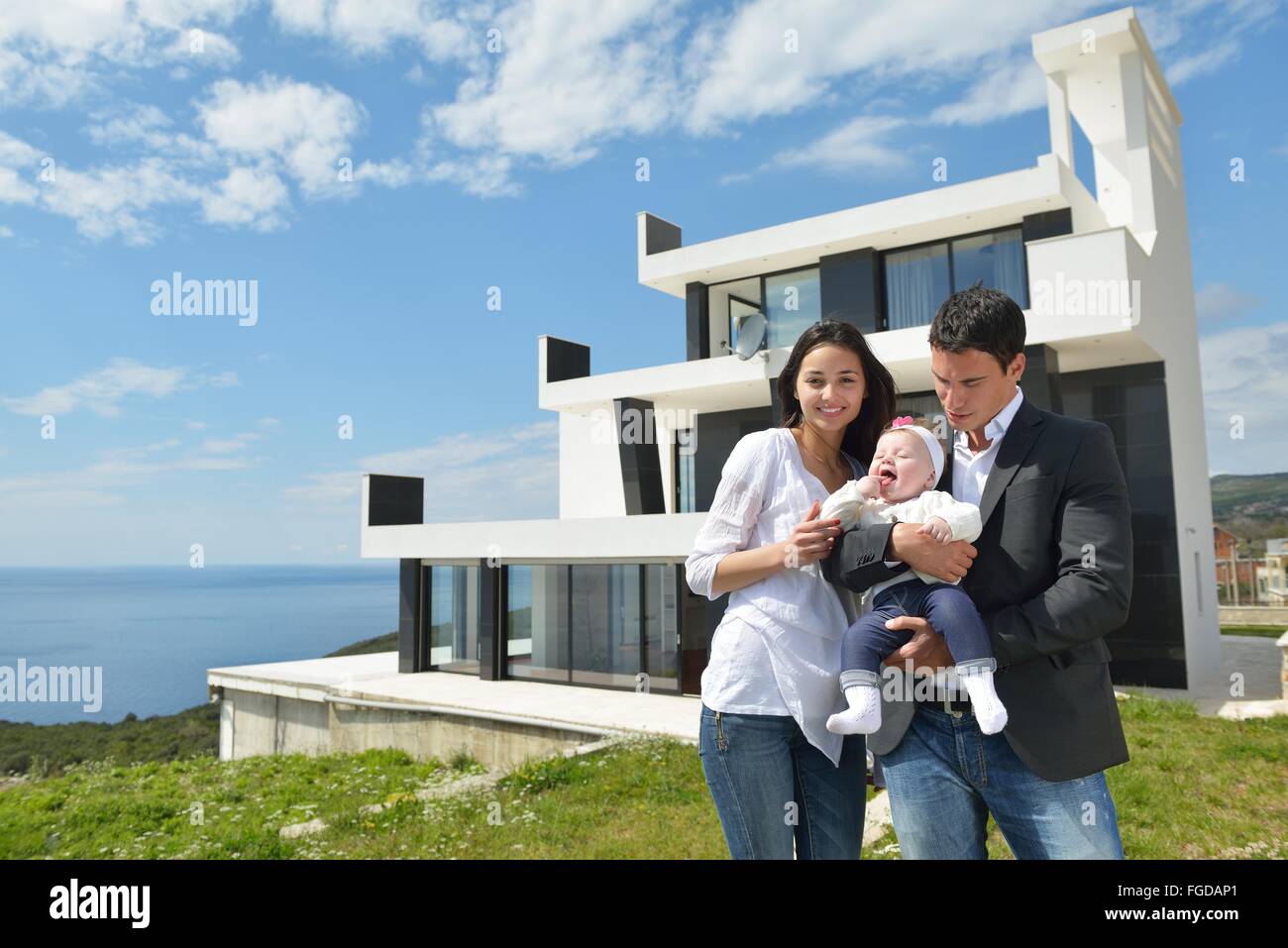 happy young family at home Stock Photo - Alamy