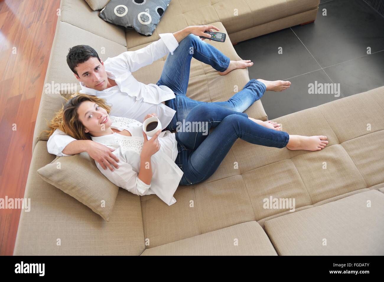 young couple relax at home Stock Photo - Alamy
