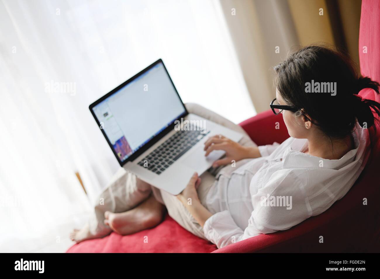 woman using a laptop computer at home Stock Photo - Alamy