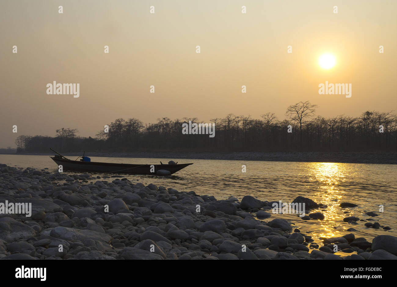 Boat on river at sunset, at border with Bhutan, Manas River, Manas N.P ...