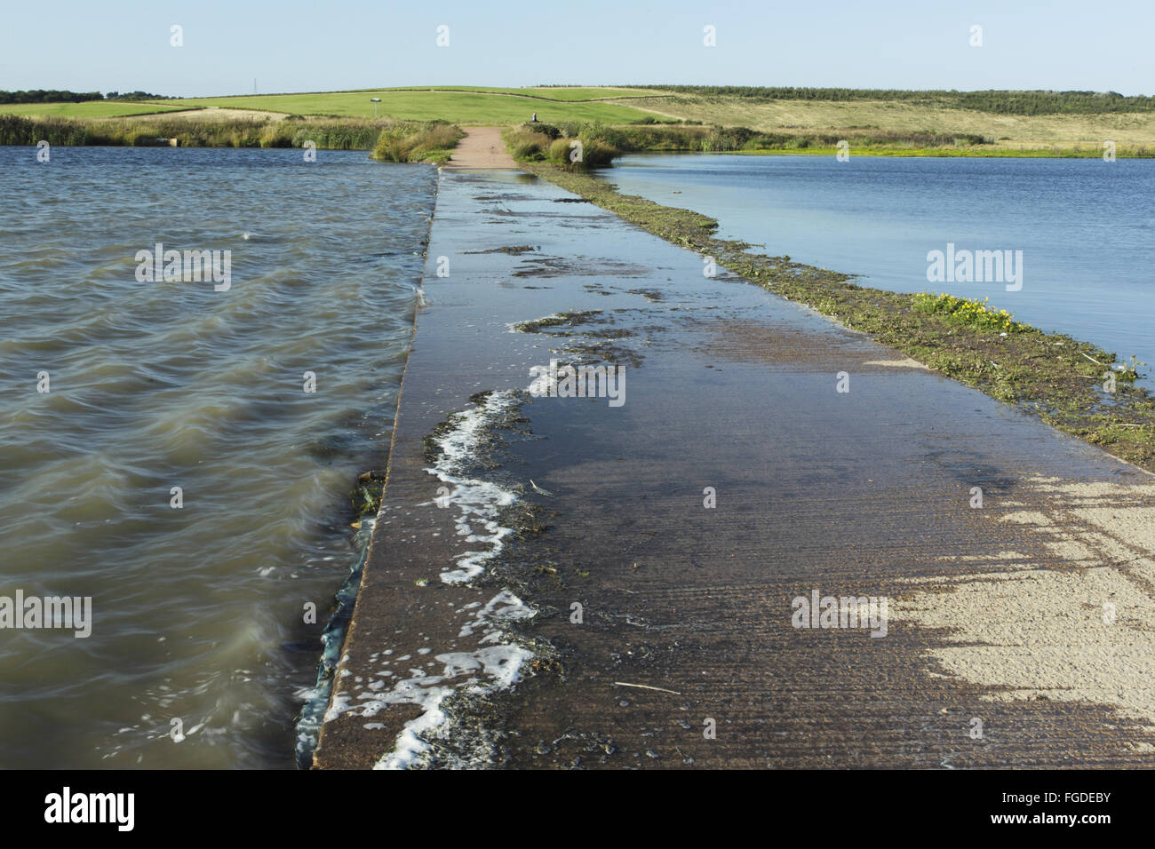 Partially flooded causeway, on site of former opencast coal mine, St ...