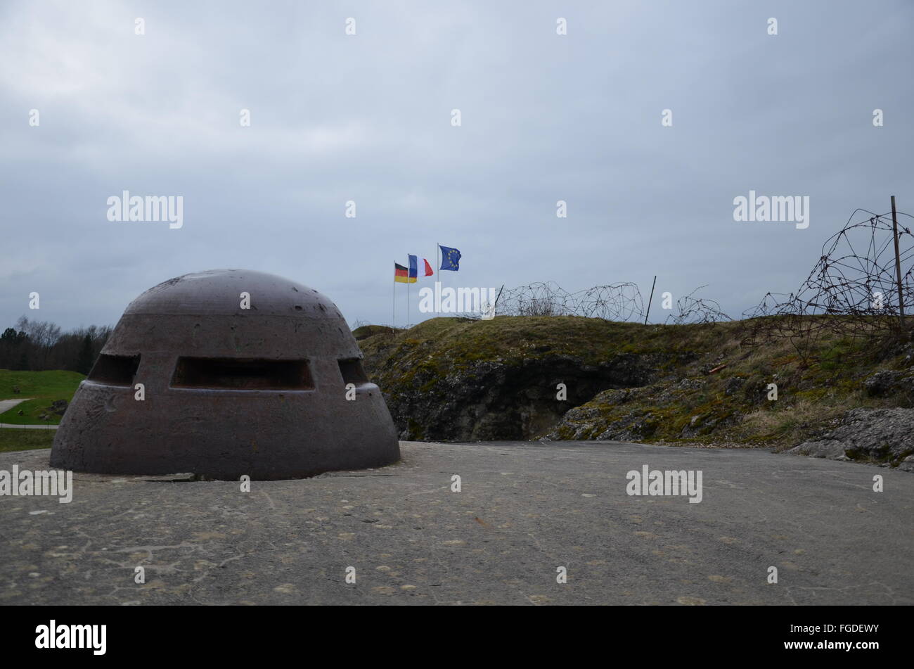 Verdun, France. 12th Feb, 2016. The French, German and EU flags fly ...