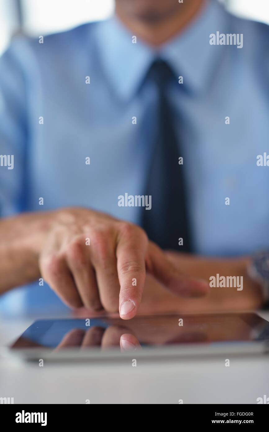 business man using tablet compuer at office Stock Photo - Alamy