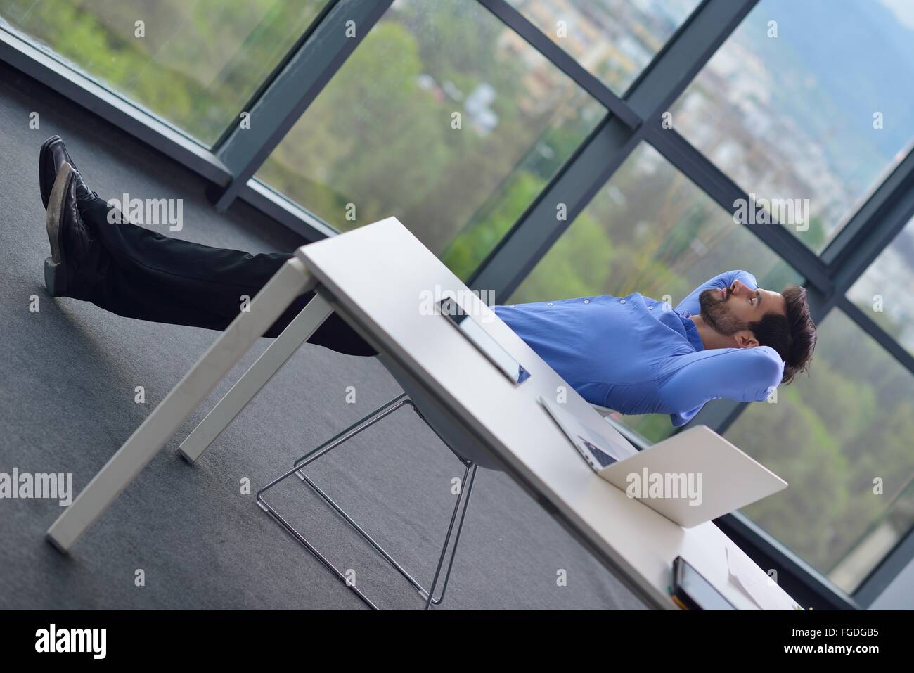 happy young business man at office Stock Photo - Alamy