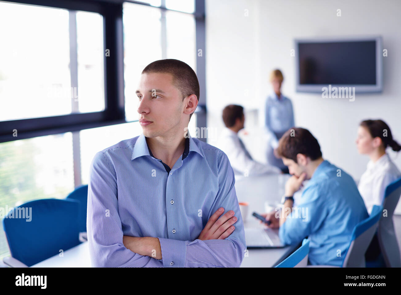 business man on a meeting in offce with colleagues in background Stock ...
