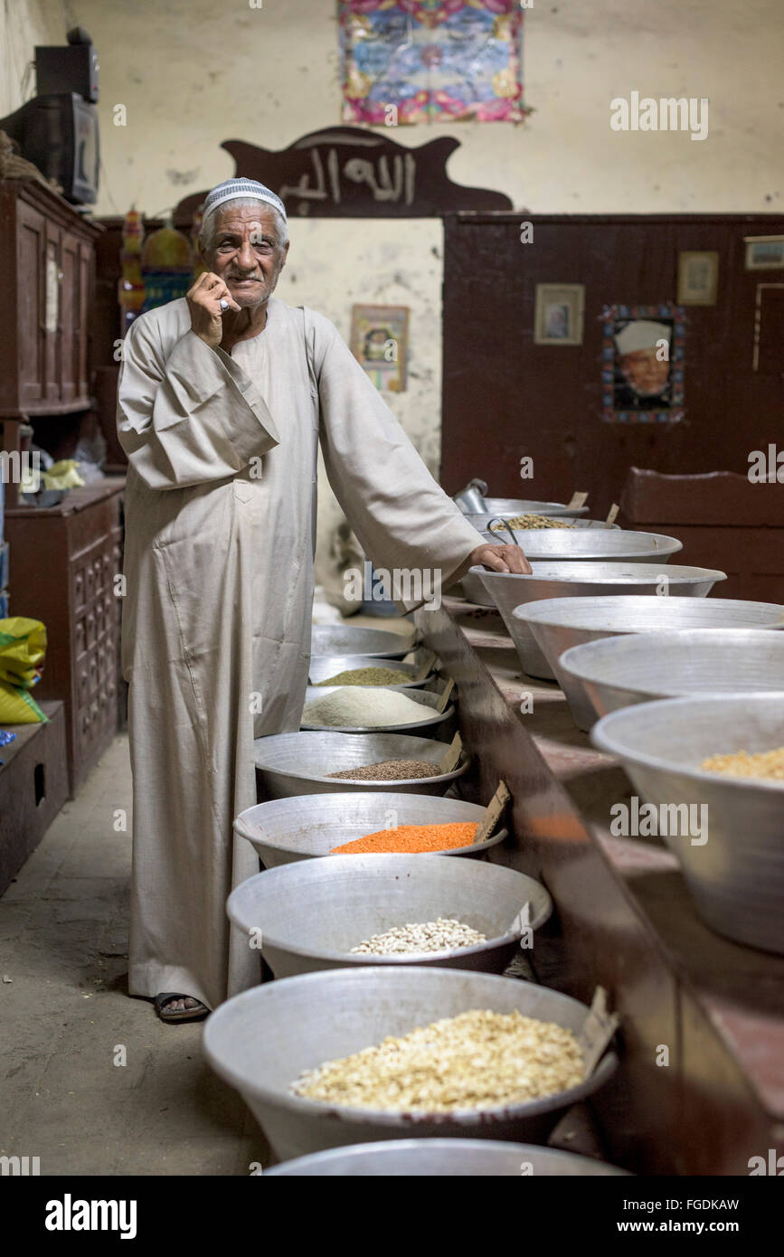 Portrait of an old store owner selling spices in a small shop Stock ...
