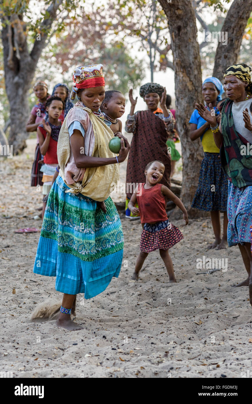 Group of people from the San tribe playing a game with a fruit called ...