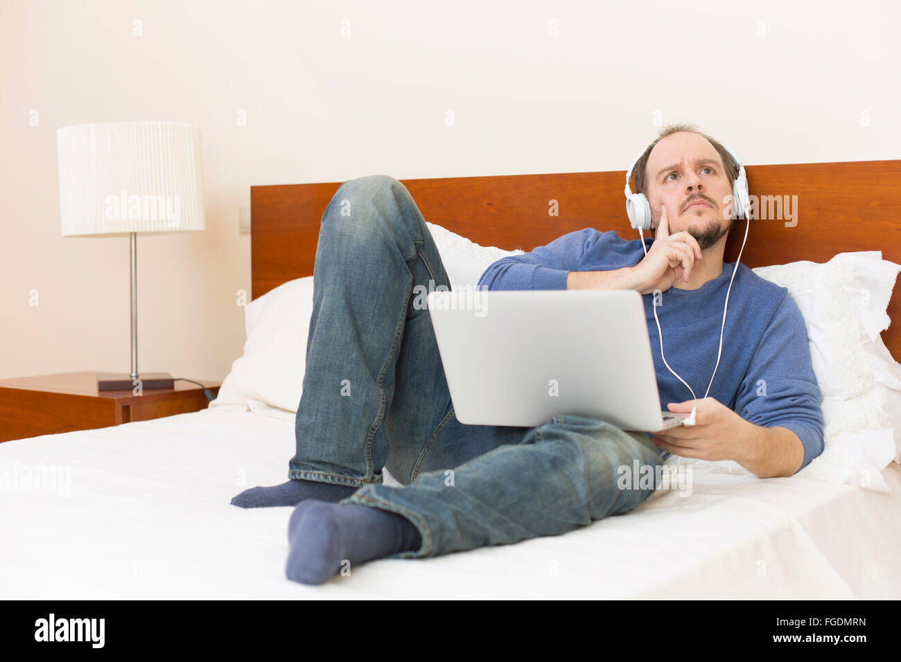 Man lying in bed notebook hi-res stock photography and images - Alamy