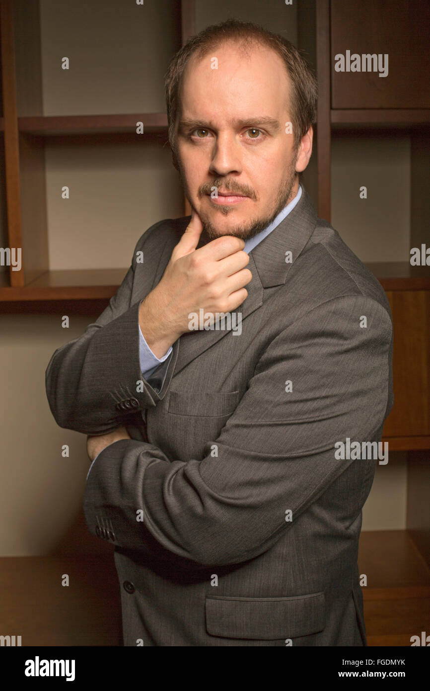 business man in home office with thoughtful look Stock Photo - Alamy