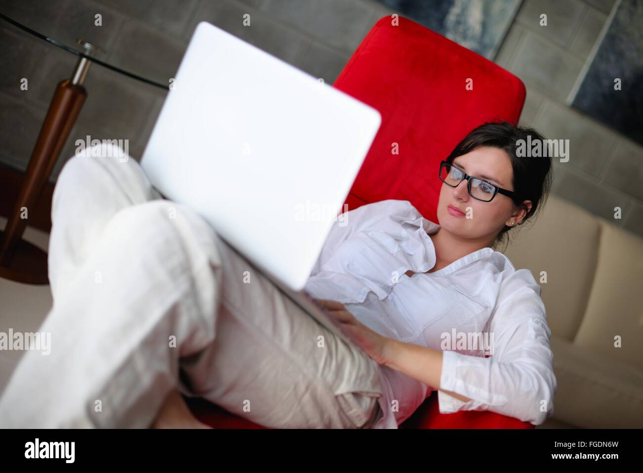 woman using a laptop computer at home Stock Photo - Alamy