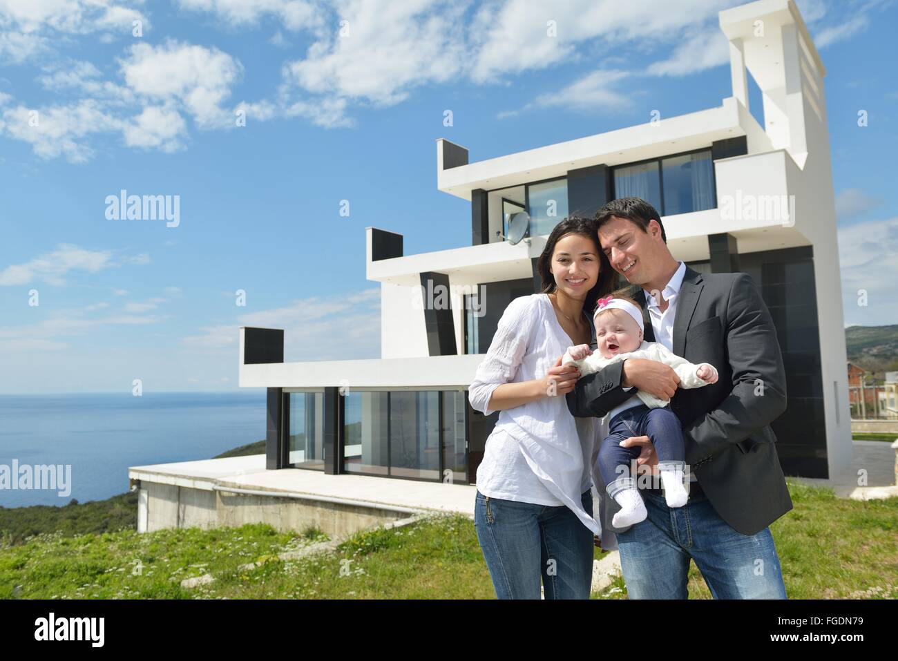 happy young family at home Stock Photo - Alamy