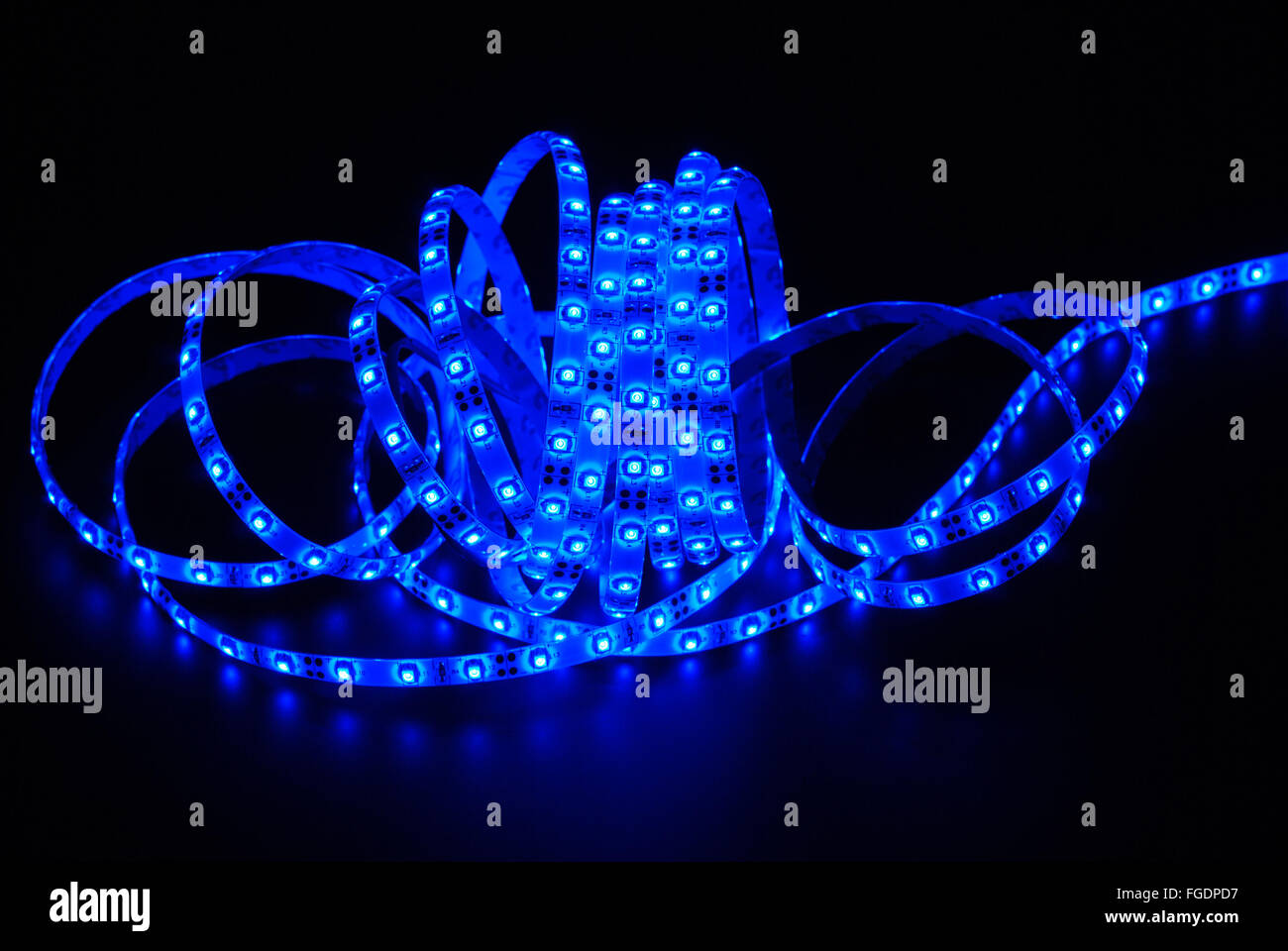 Blue led strip on the black background Stock Photo - Alamy