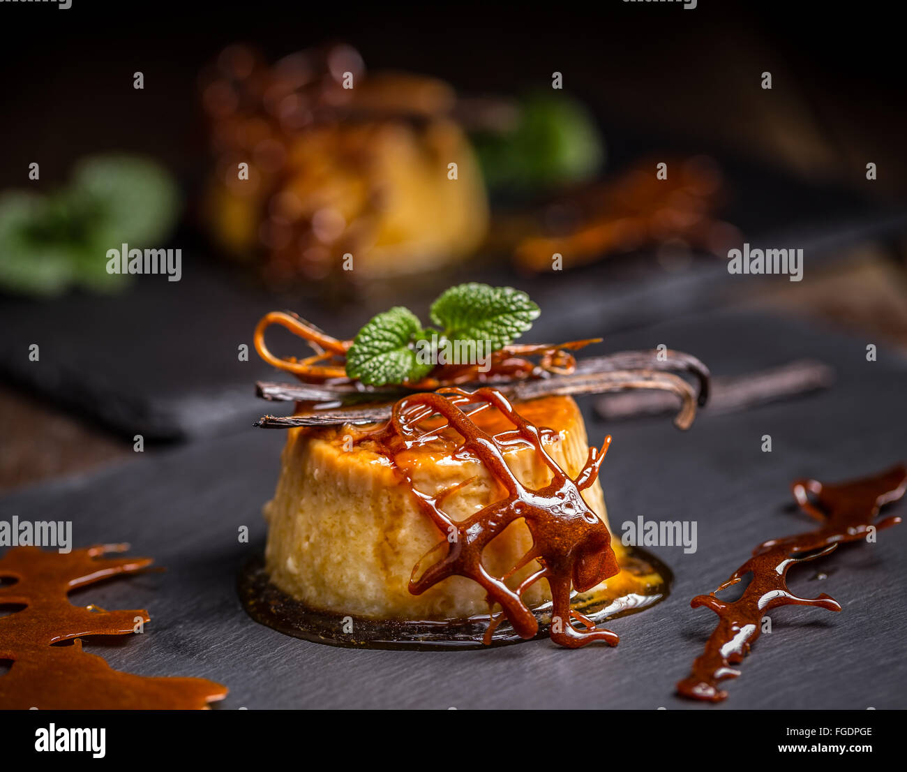 Homemade creme caramel served with sweet syrup, a traditional dessert ...