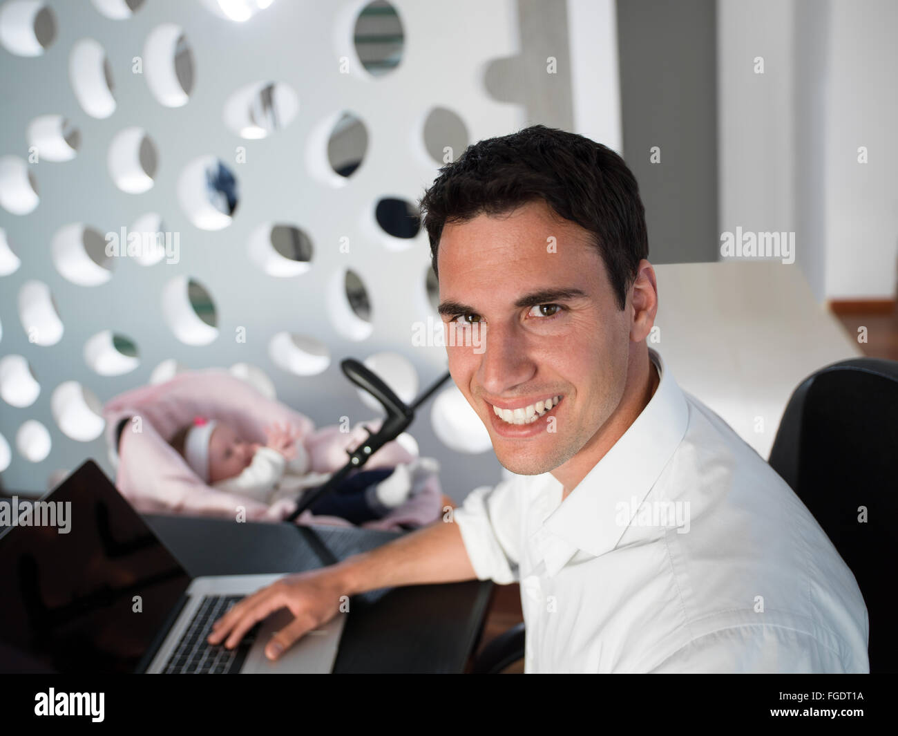 man working from home and take care of baby Stock Photo - Alamy