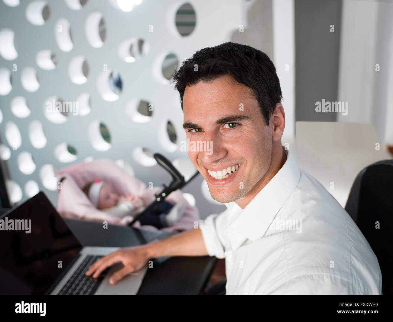 man working from home and take care of baby Stock Photo - Alamy
