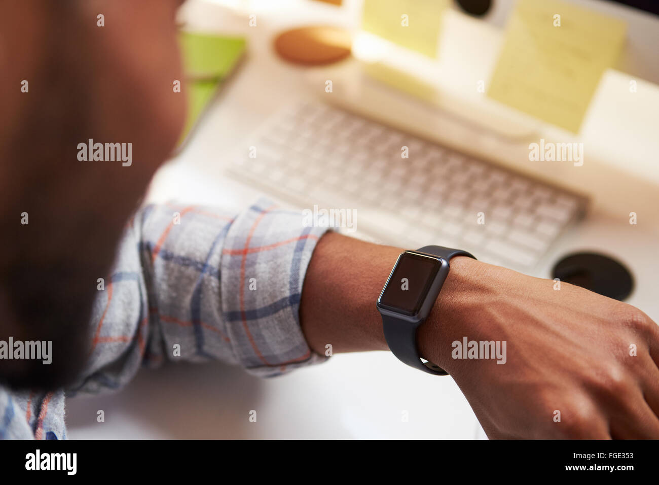 Close Up Of Businessman Wearing Smart Watch In Design Office Stock ...