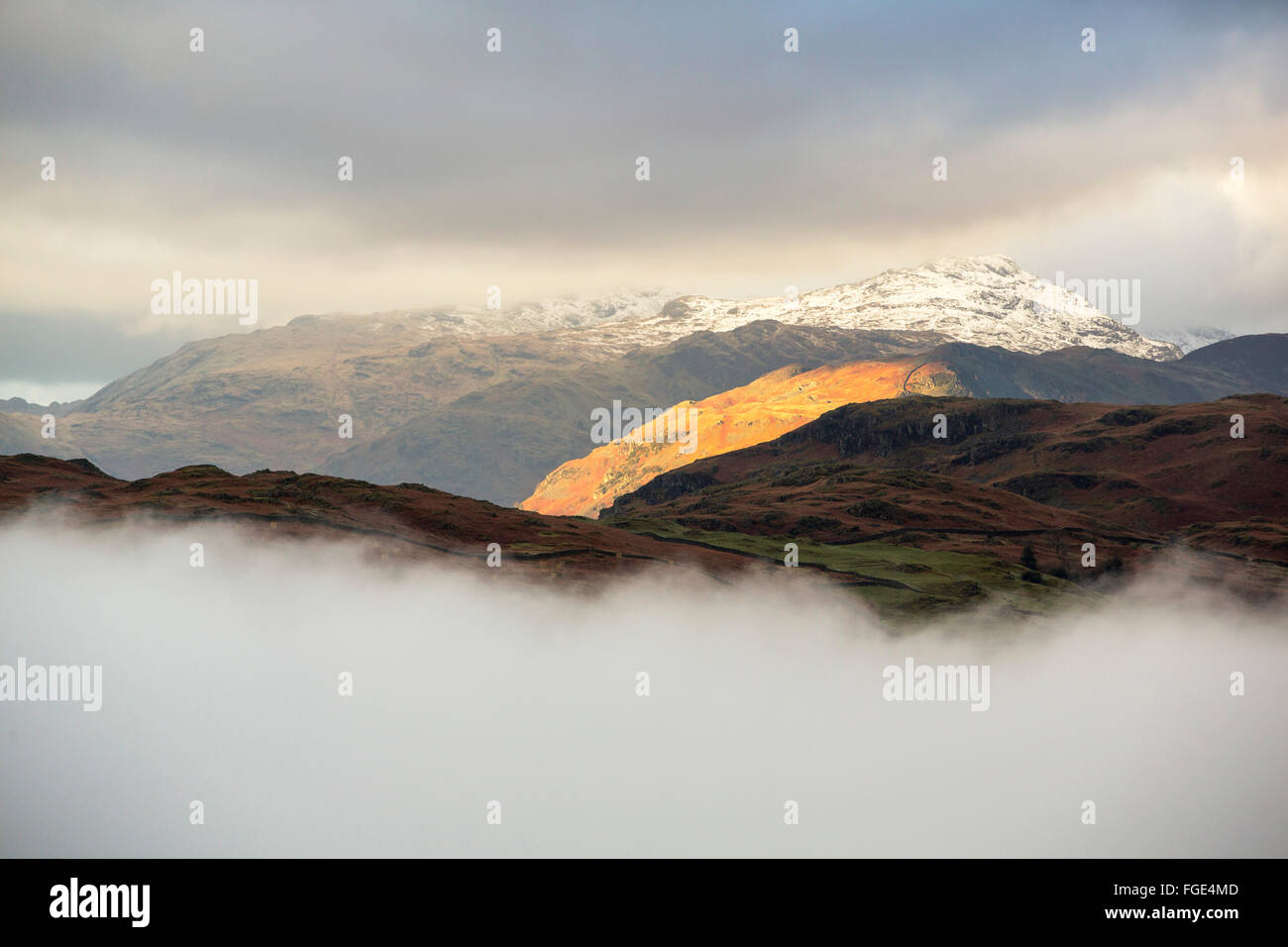Wetherlam in the Lake District at dawn, sandwiched between valley mist ...