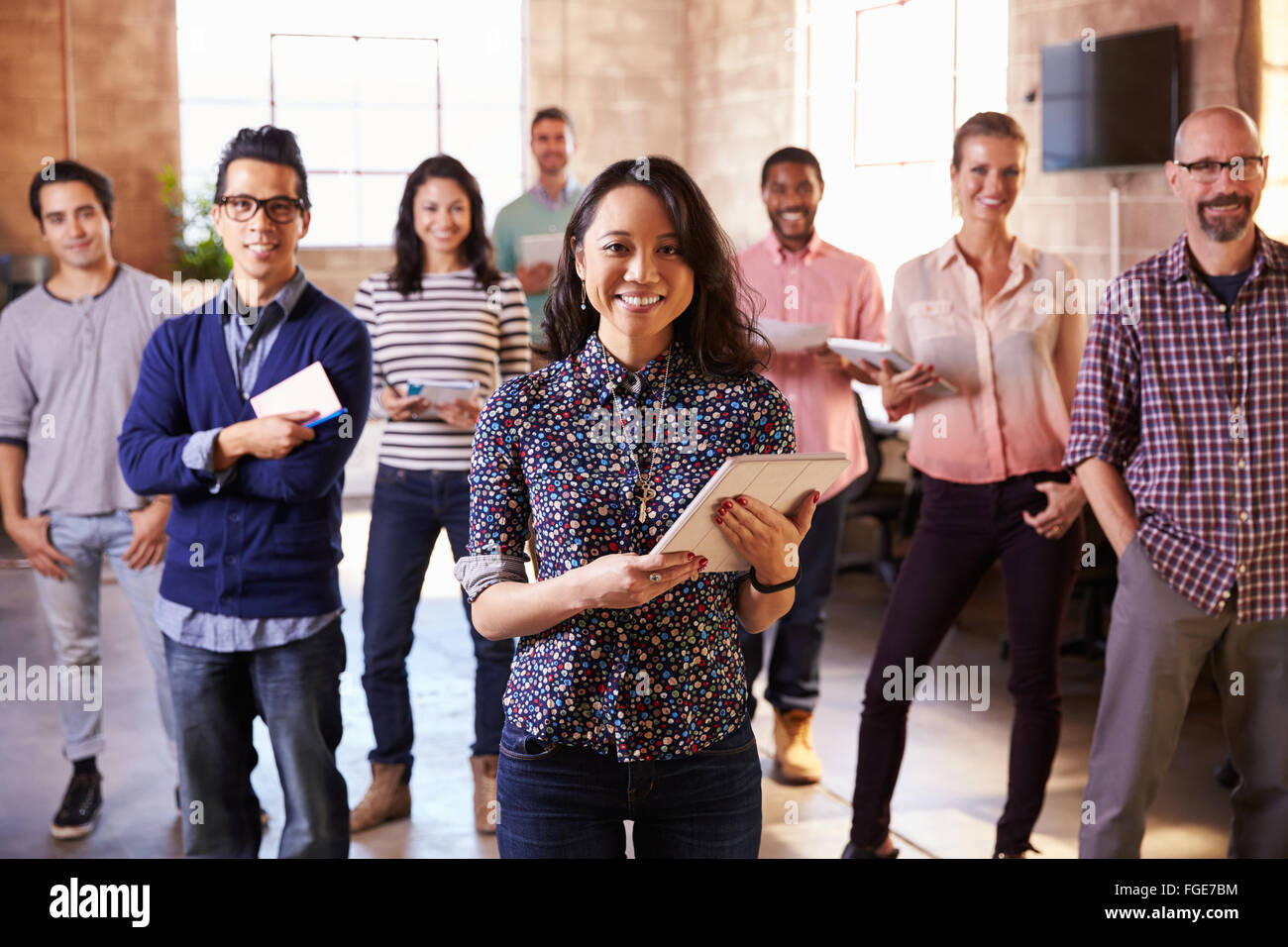 Portrait Of Staff Standing In Modern Design Office Stock Photo - Alamy